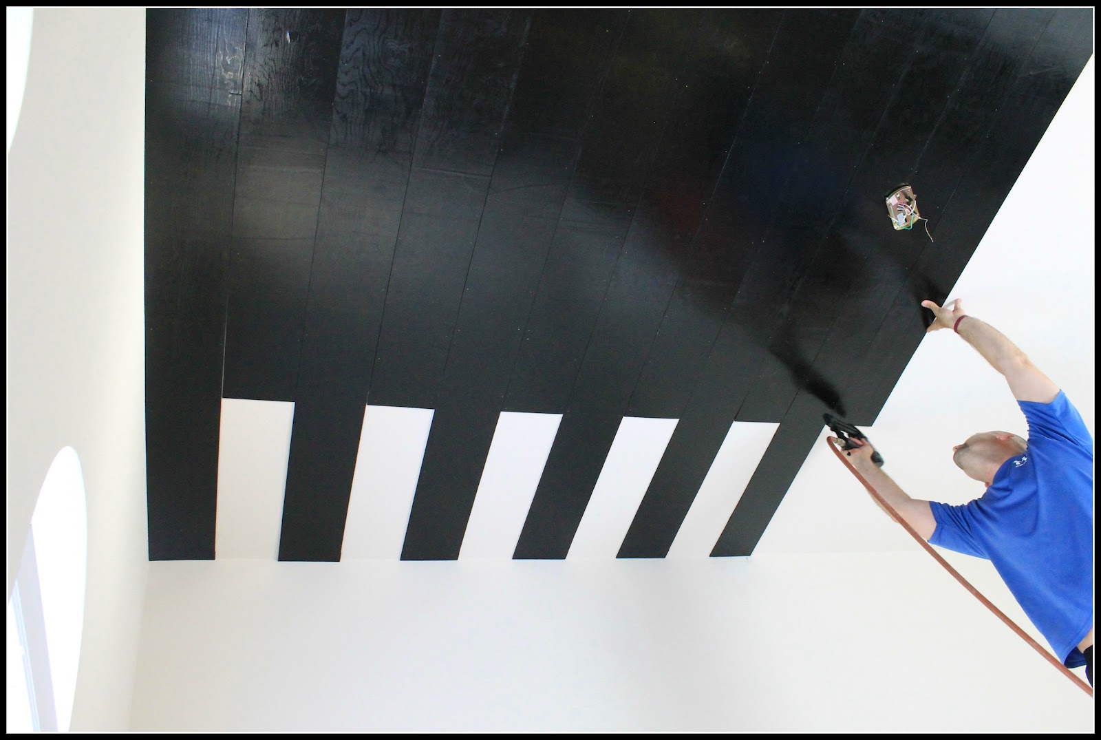 Make Them Wonder: Glossy Black Plank Ceiling