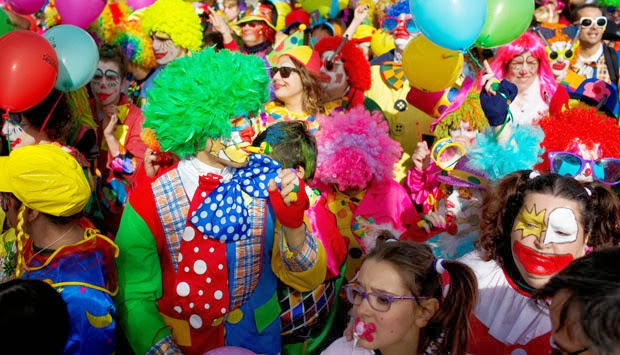 Clown carnival parade along the waterfront in Sesimbra, Lisbon ...