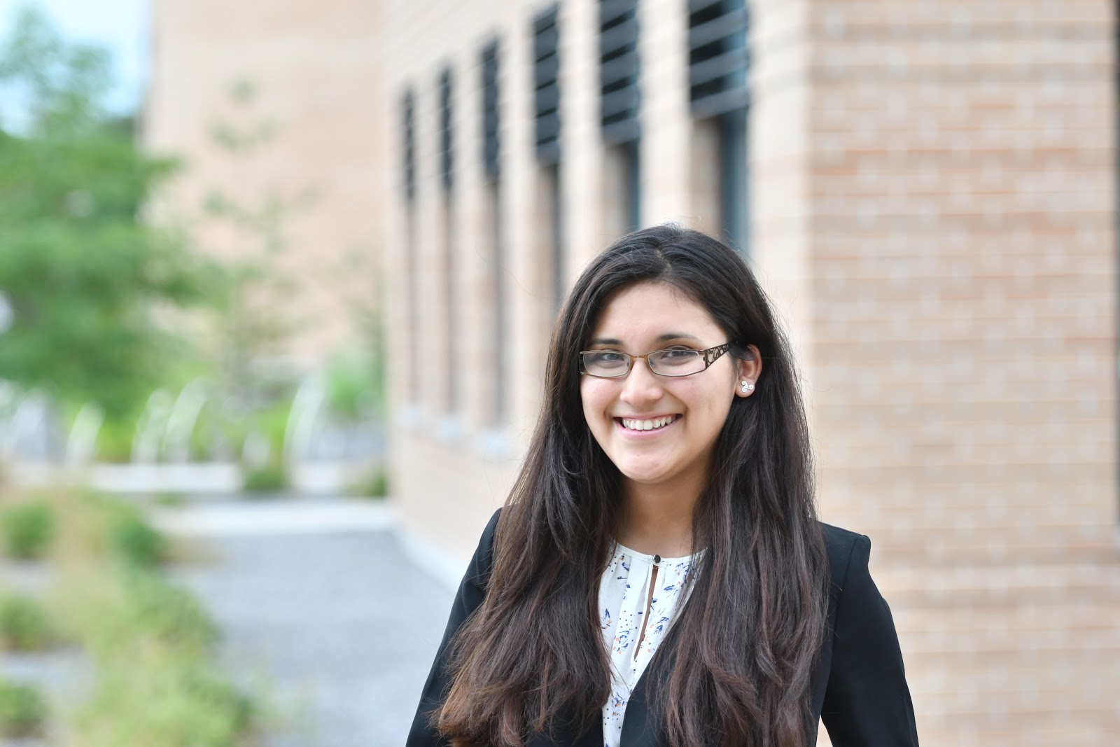 Alum's Academic Success Rooted in Parents’ Sacrifice, Hard Work