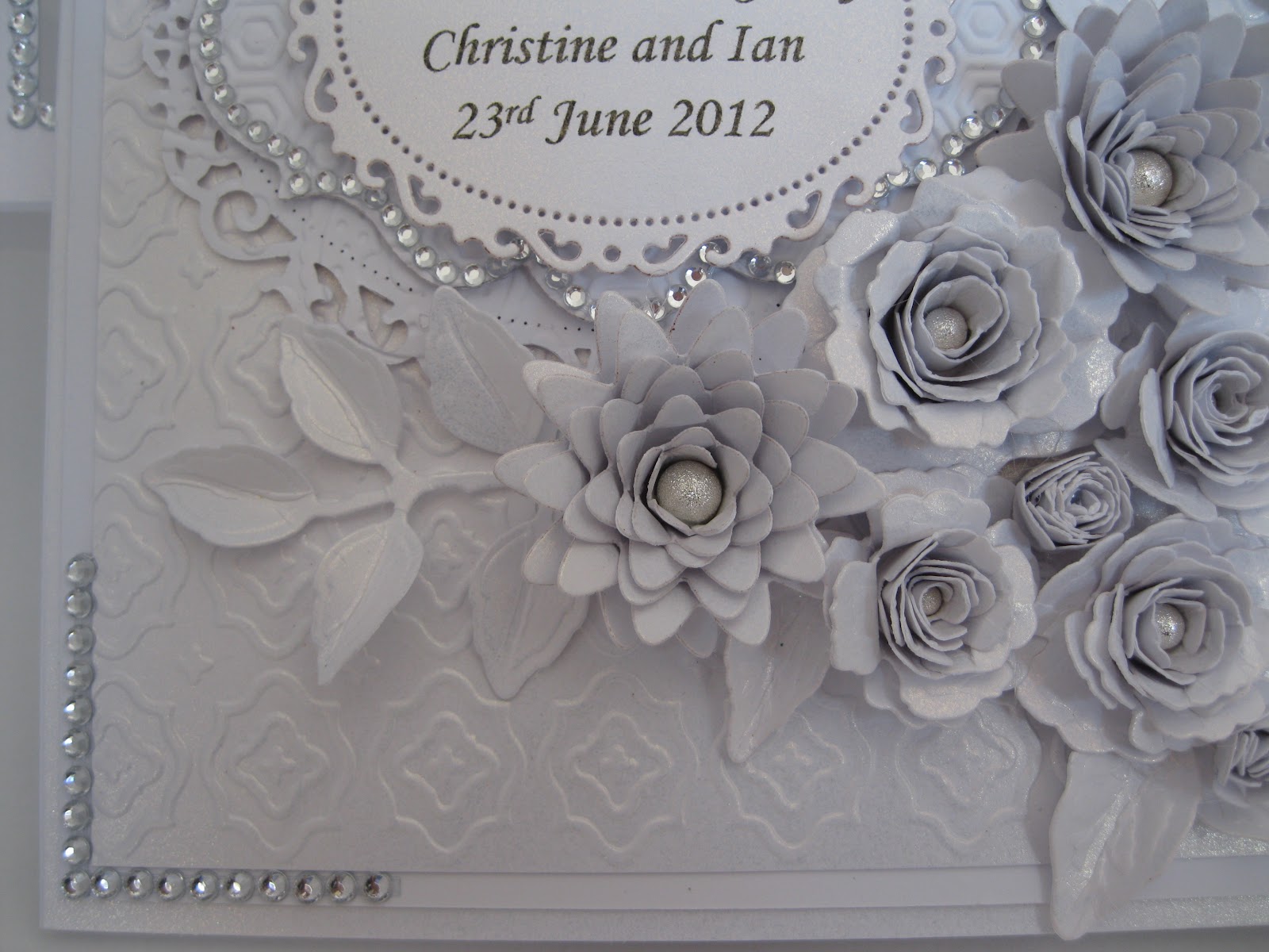 Flowers, Ribbons and Pearls: Silver and White Wedding Card.