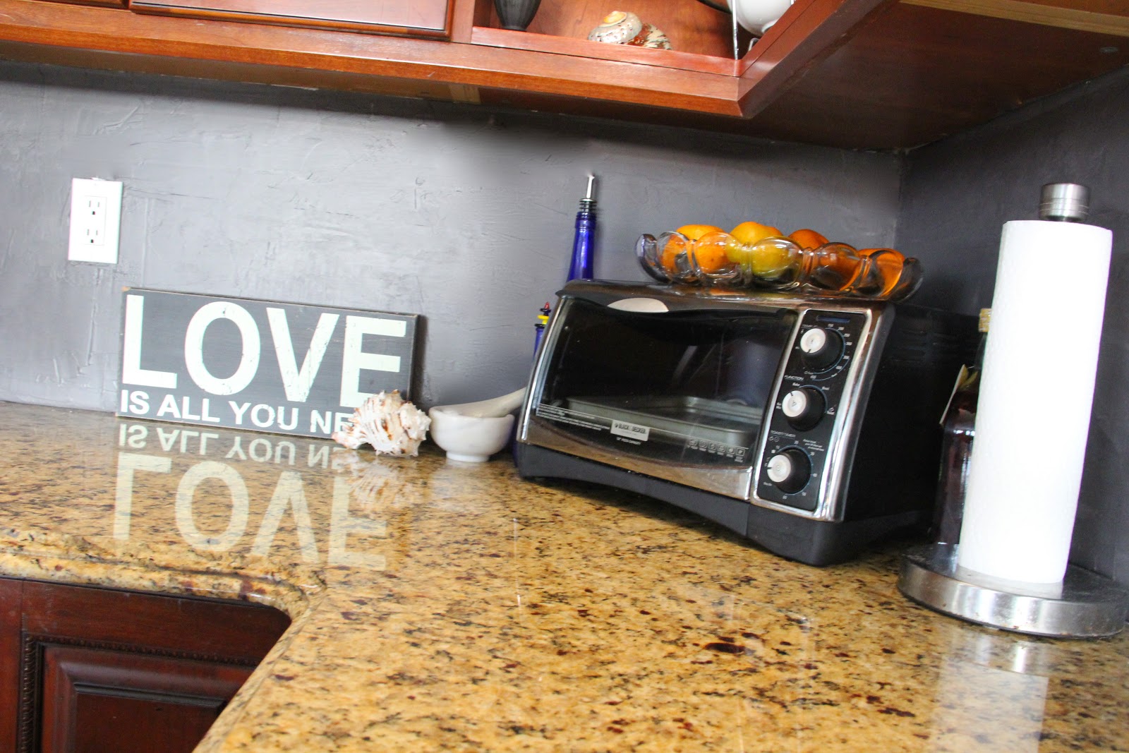 Sheer Serendipity: Charcoal black plaster backsplash