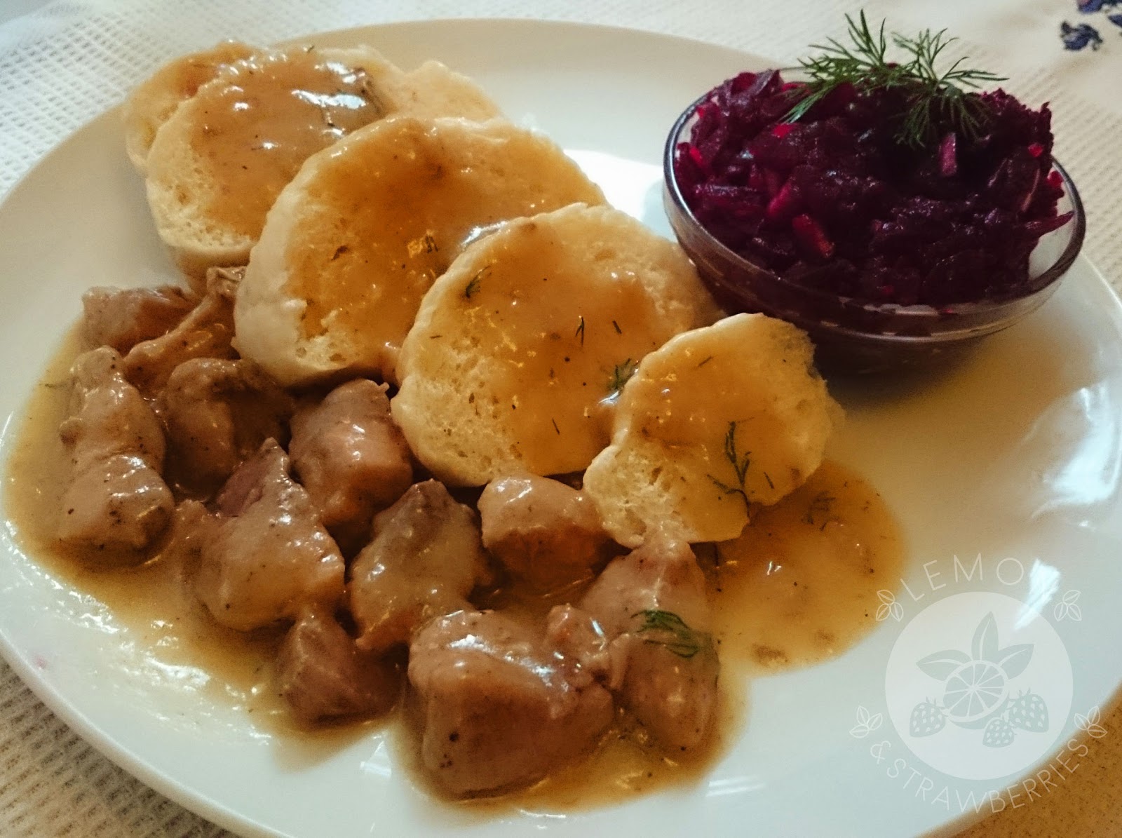Polish steamed dumplings (Pampuchy) with pork stew and beetroot salad