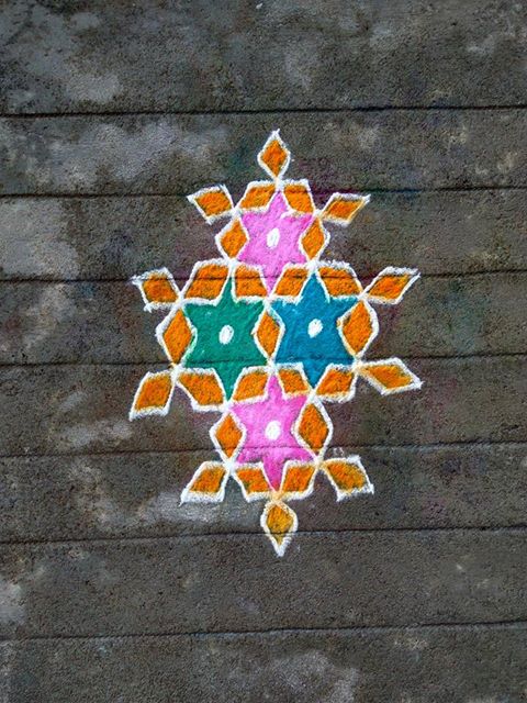 CHODAVARAMNET: SIX LOTUS FLOWERS IN A HEXAGON RANGOLI ART