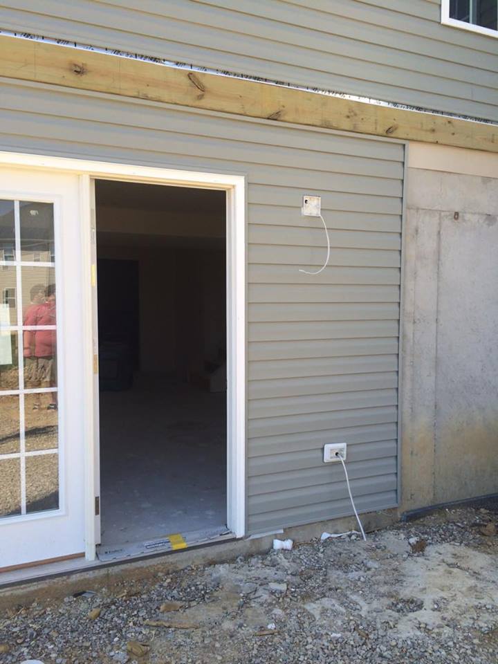 Building Our Dream Home: Week 8 Progress- Siding and Priming
