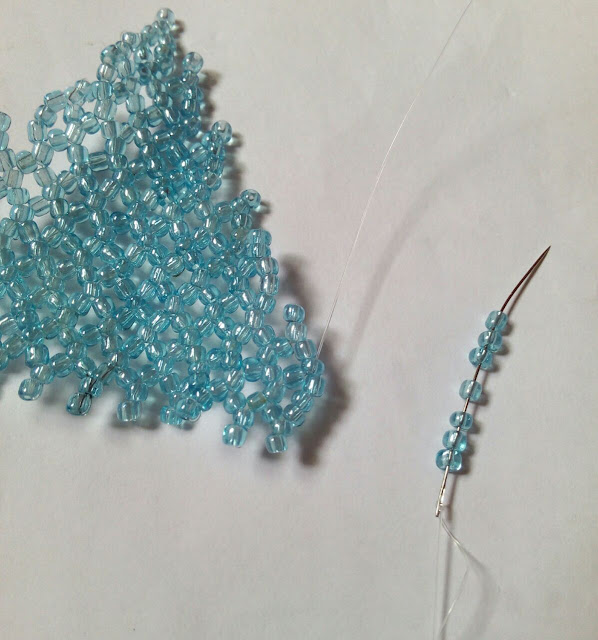 Beadination: Beautiful beaded flower using the bead netting technique.