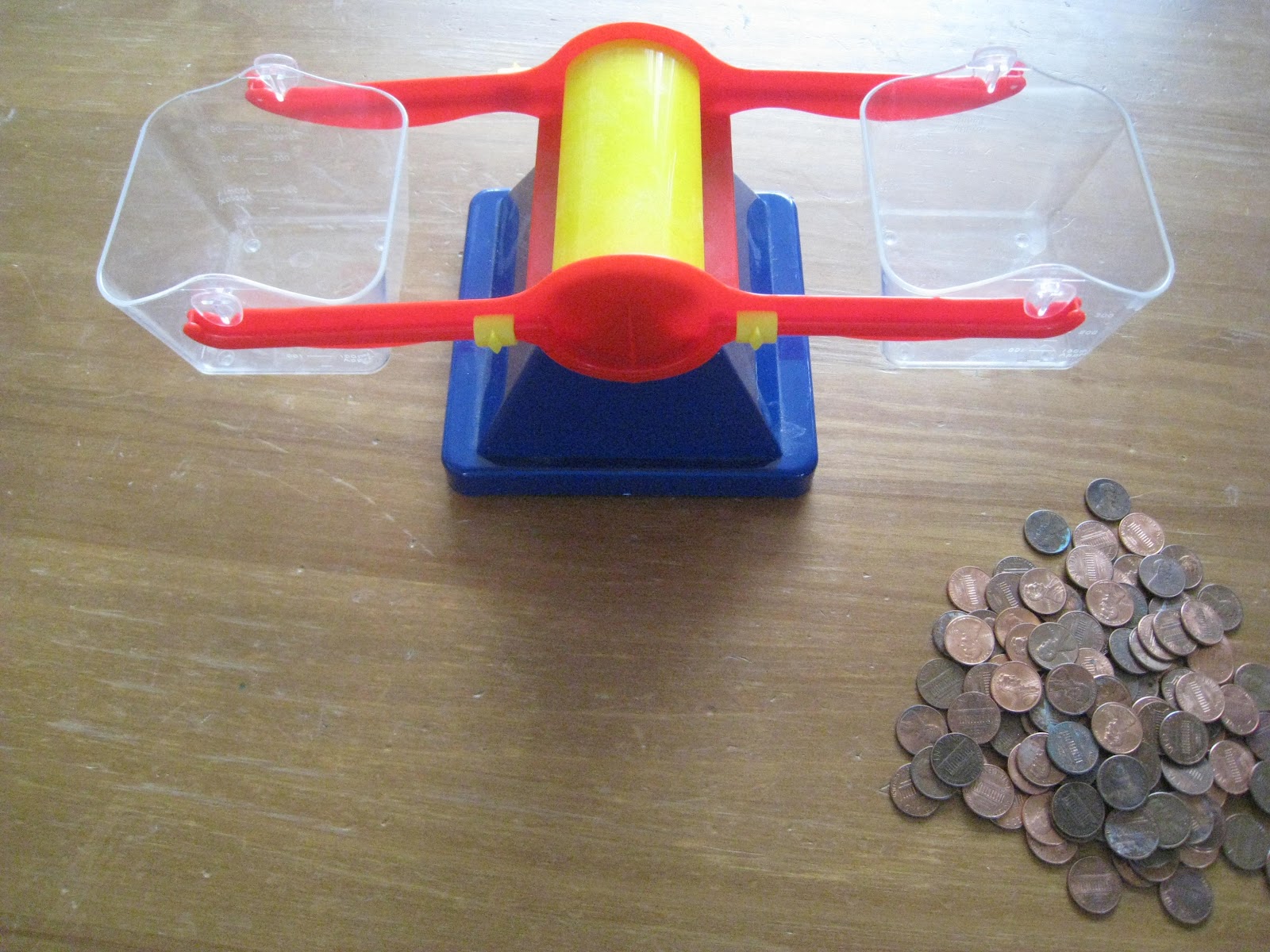 Weighing with Pennies: A Hands-On Math Activity for Kids - Teach Beside Me