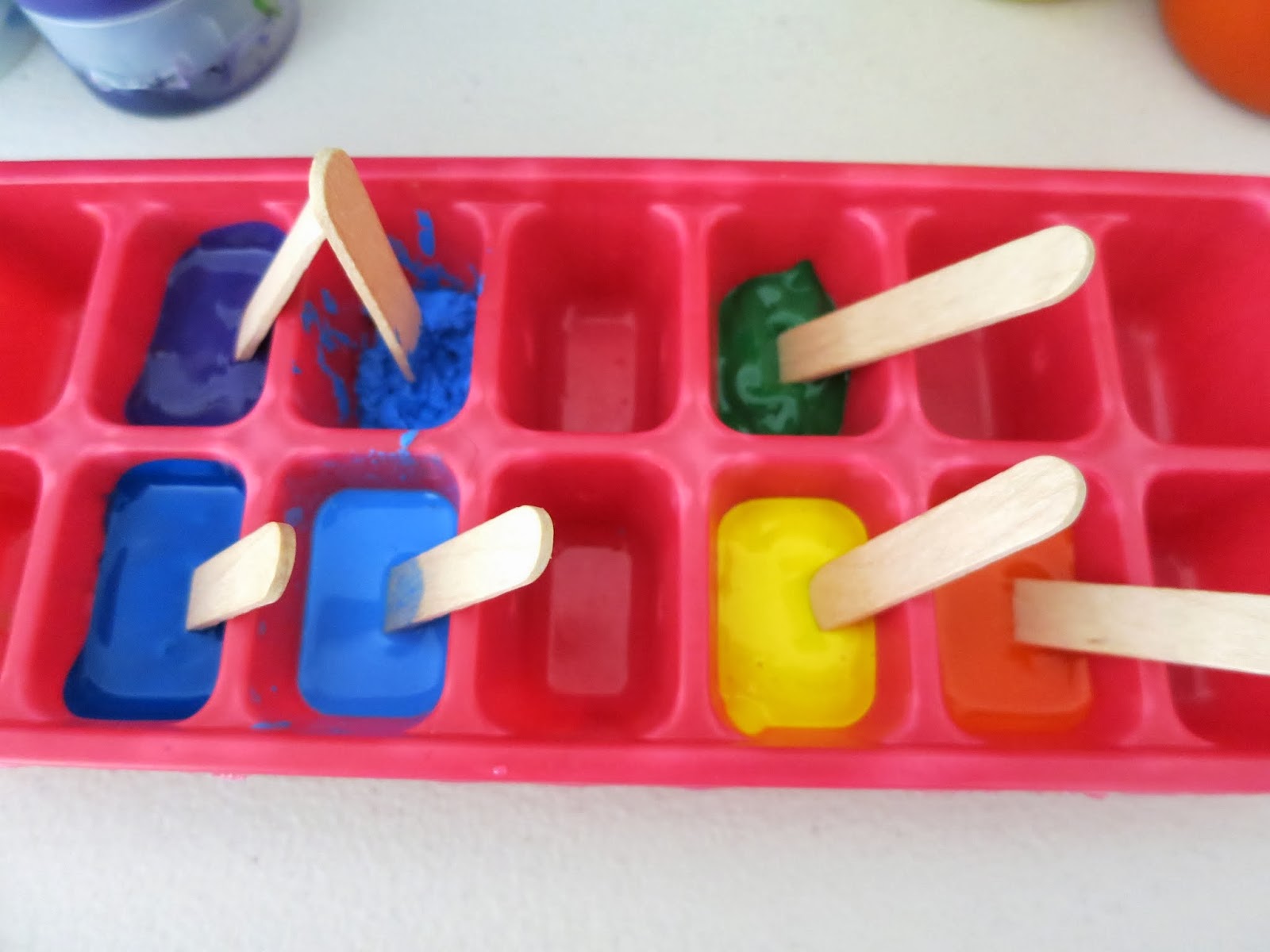Learn with Play at Home: Paintsicles. Frozen paint cubes for creative fun.