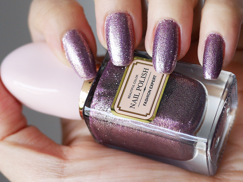 [Nails against bottle]