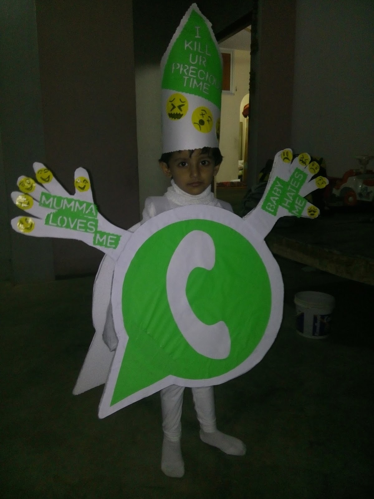 My baby dressed as what's app costume made by my wife