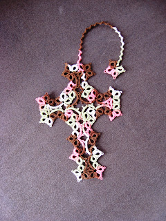 Taming Roses: A Pretty Cross using Clover motifs...