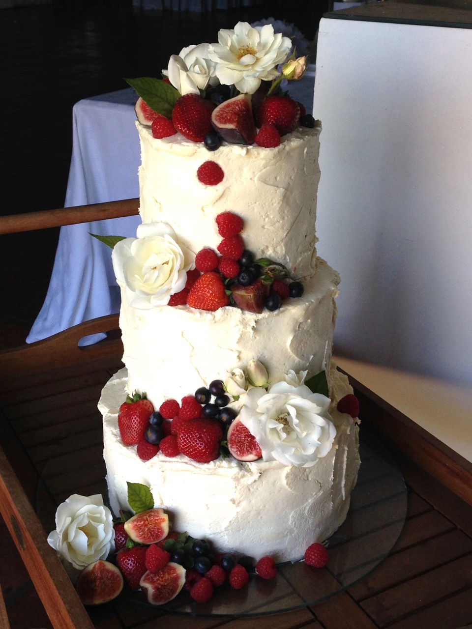 Buttercream and fresh berries wedding cake