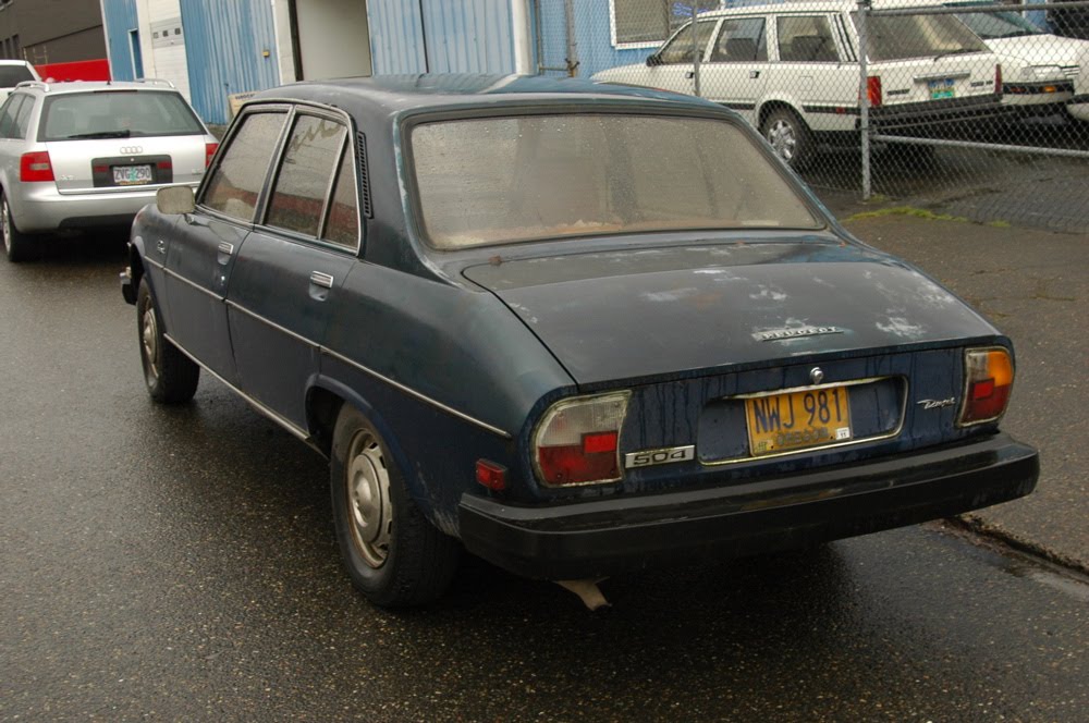 OLD PARKED CARS.: 1979 Peugeot 504 Diesel Sedan.