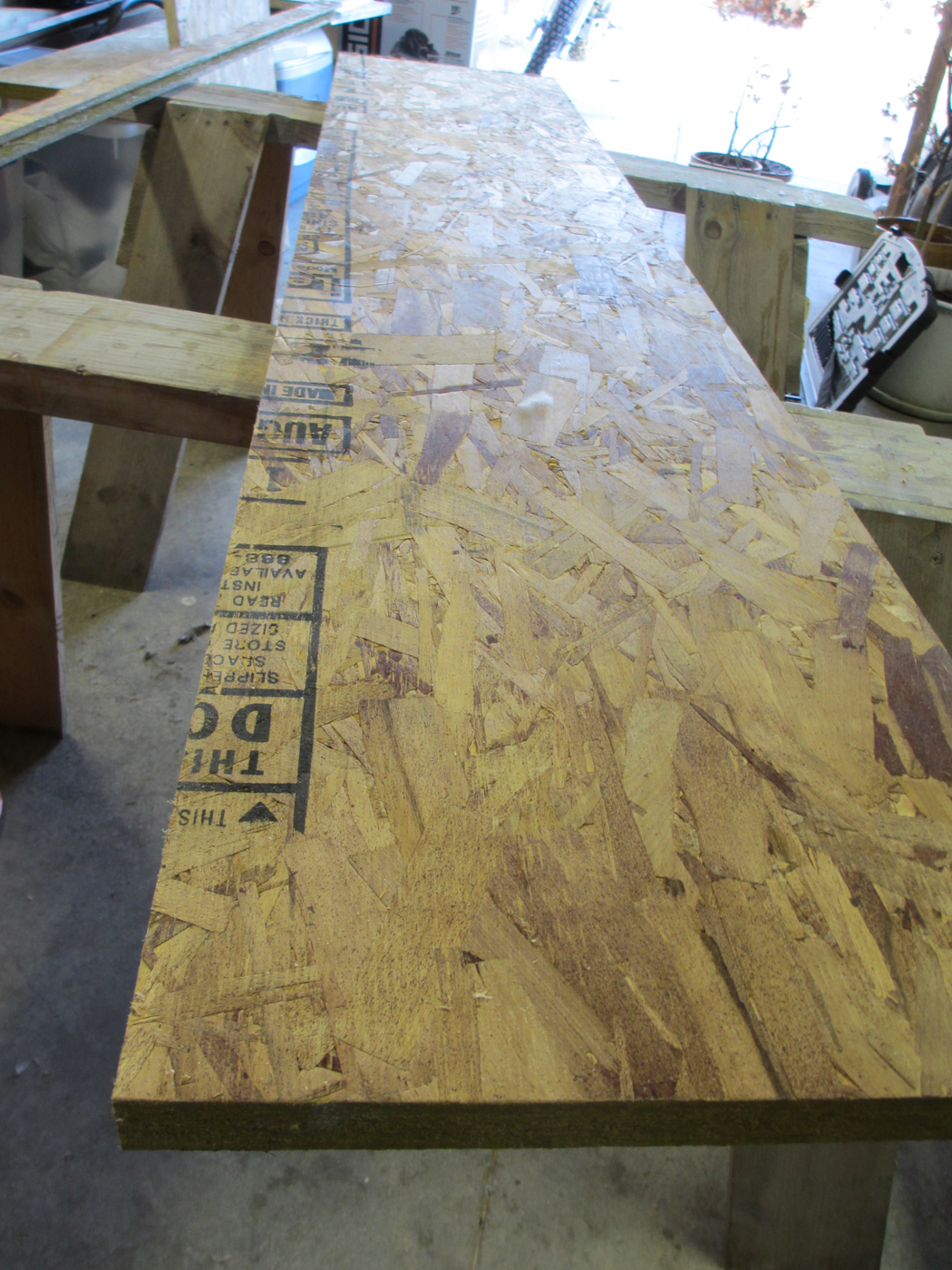 our homegrown spud: a couple of DIY OSB tables.