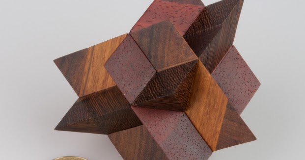 Puzzling Times: Toulouzas’ Triple Rhombic Pyramid