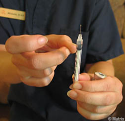 Tap the syringe prior to injection