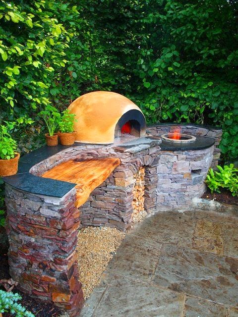 Tandoor oven, prep space and Pizza oven all in one! This will be a must ...