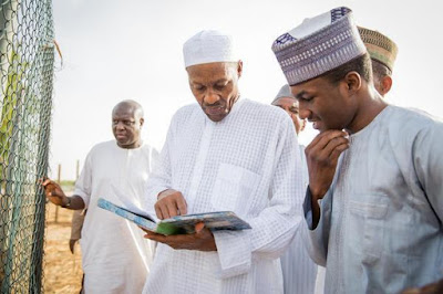 President Buhari and his son, Yusuf at his farm in Duara earlier today