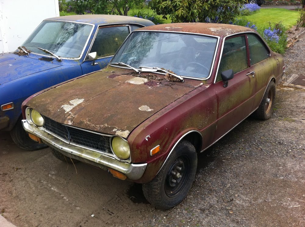 OLD PARKED CARS.: Mossy Mazda #2: Badgeless 1971 Mazda R100 Coupe.