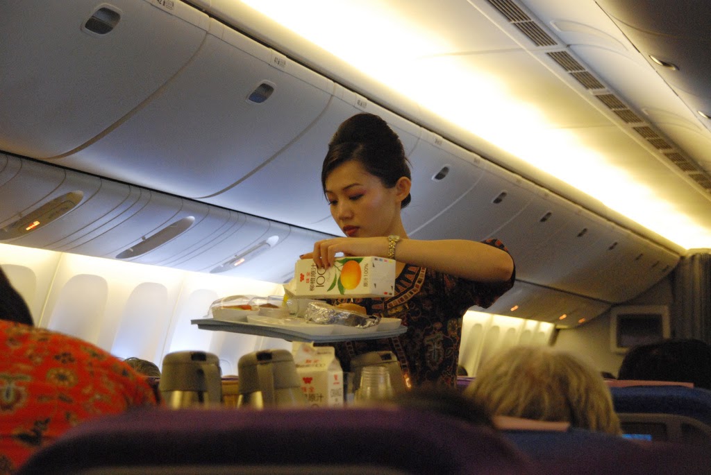 Pretty Singapore flight attendant doing in flight service ~ World ...