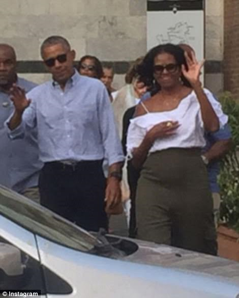Michelle Obama bares shoulders and arms in flirty top and she and ...