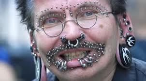 But more than half of his many piercings are around his genital area.