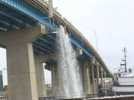 Living and Playing in Destin FL: Brooks Bridge versus a barge