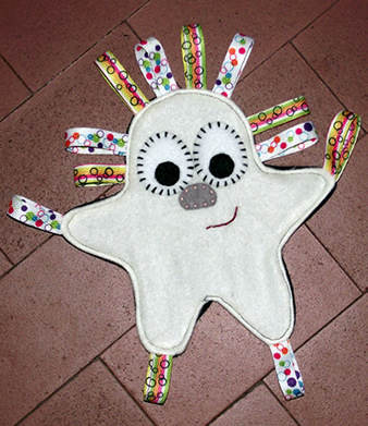 Happily poddling along...: Taggie toy free pattern