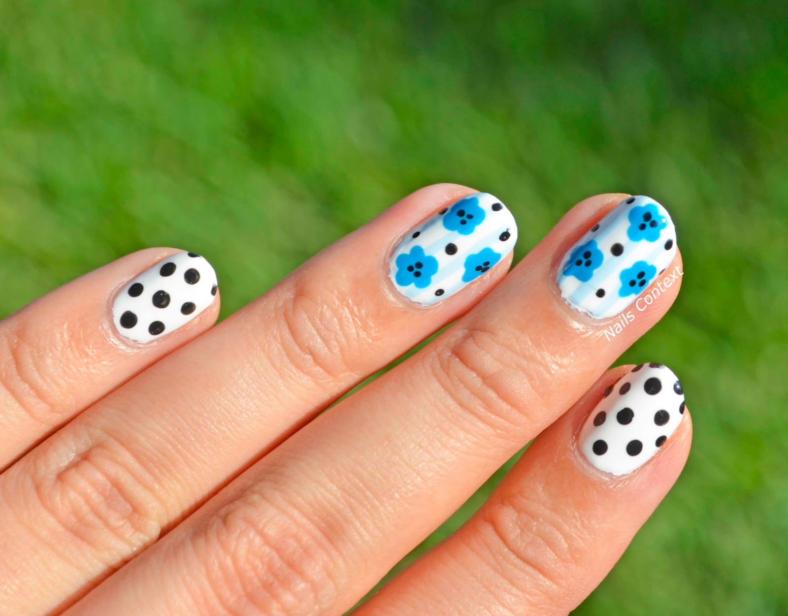 Nails Context: Blue spring flowers