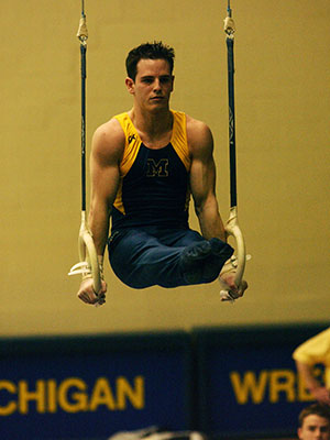 kenneth in the (212) jump: Michigan gymnastics coach Scott Vetere ...