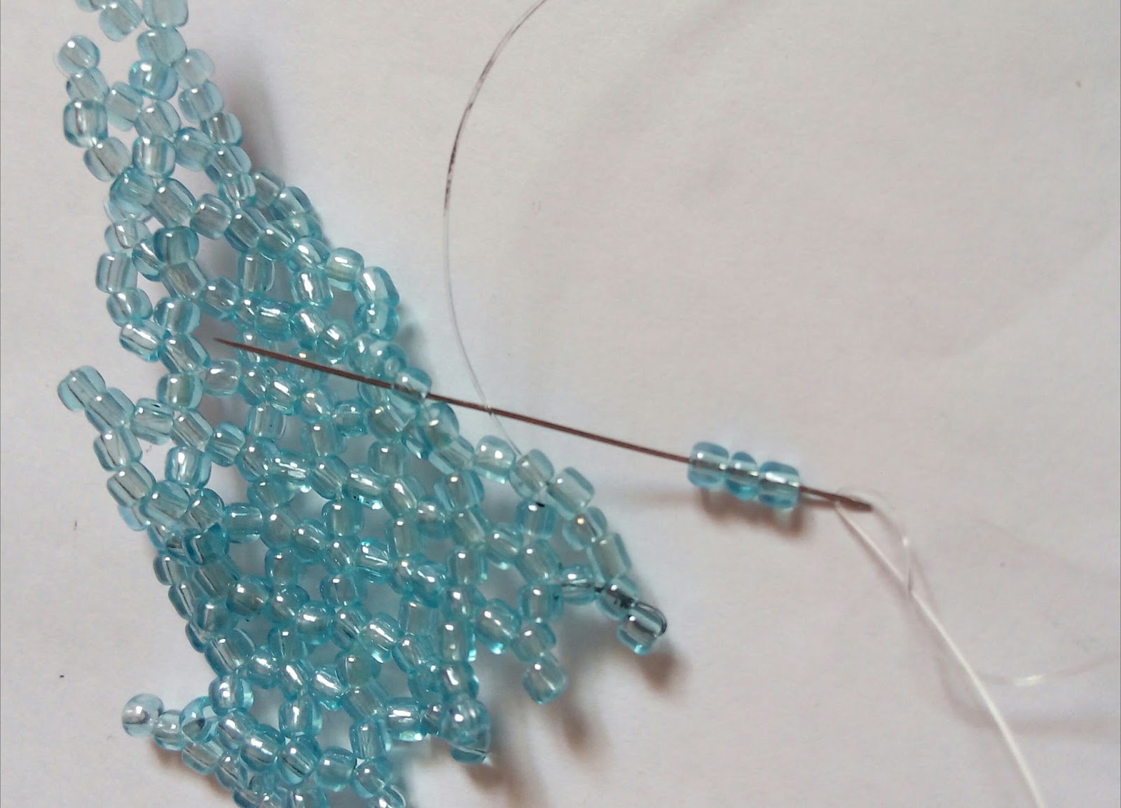 Beadination: Beautiful beaded flower using the bead netting technique.