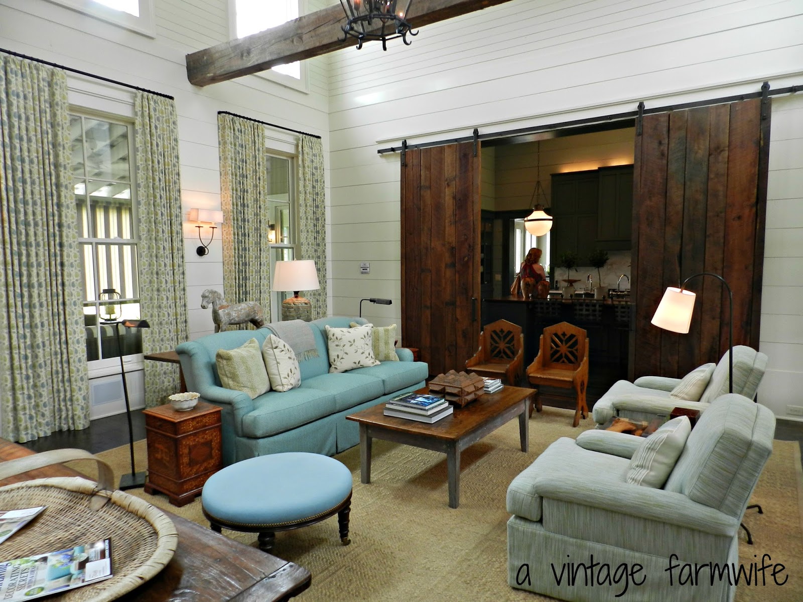 This is the sitting area to the right. The kitchen is through the ...