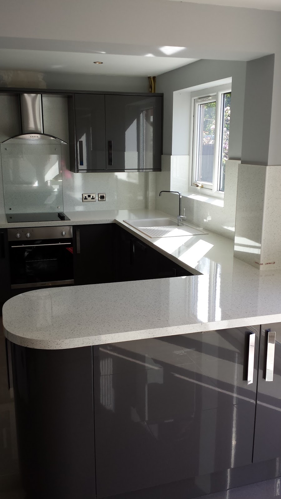 Elm Kitchens and Joinery: Howdens Kitchen in dark grey gloss with a ...