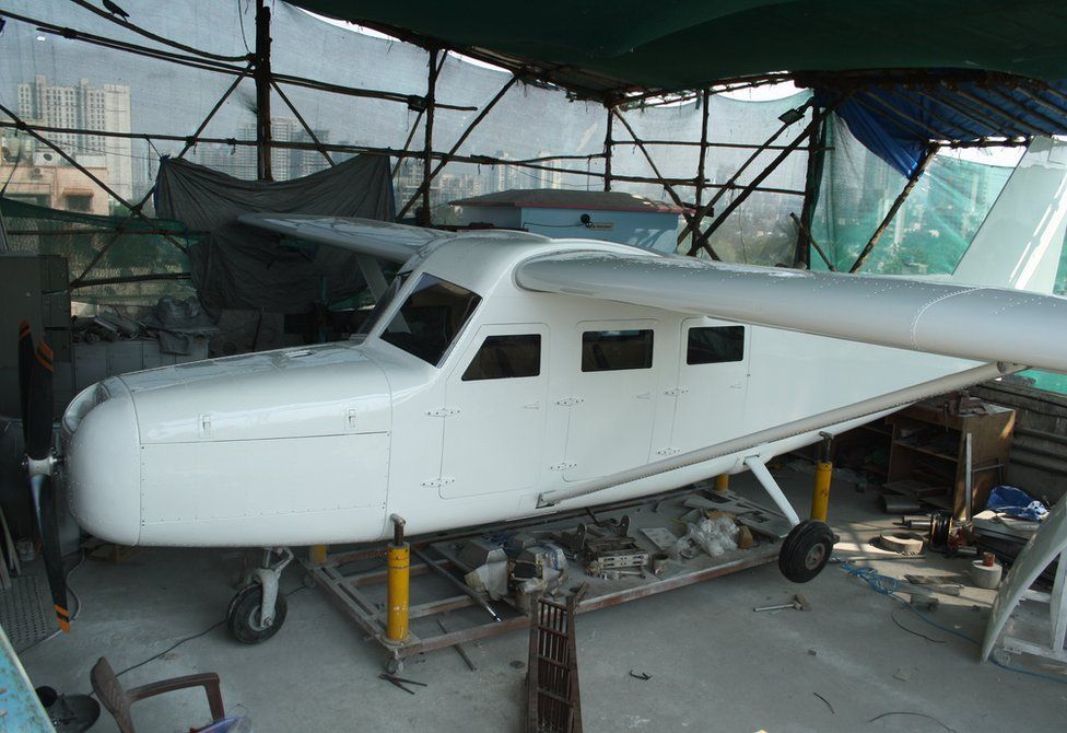 Man builds airplane on apartment roof