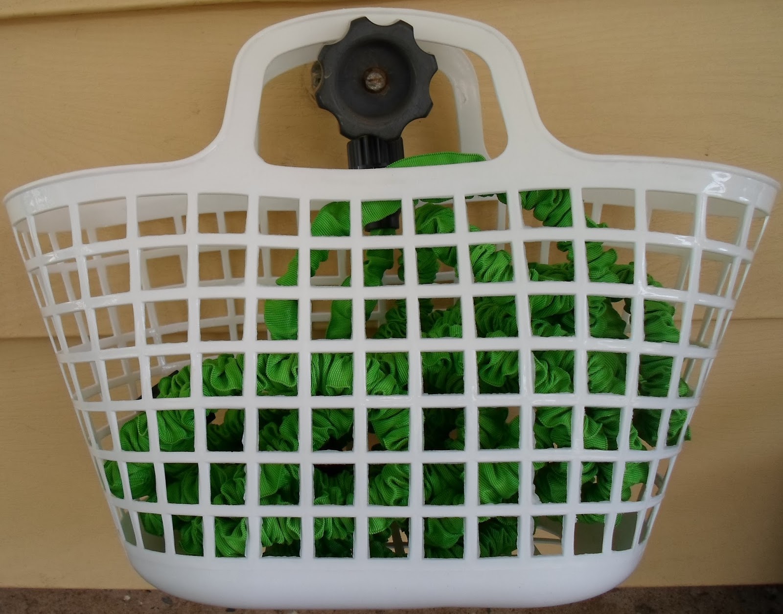 Happier Than A Pig In Mud: $1 Hanging Storage for a Flexible Hose