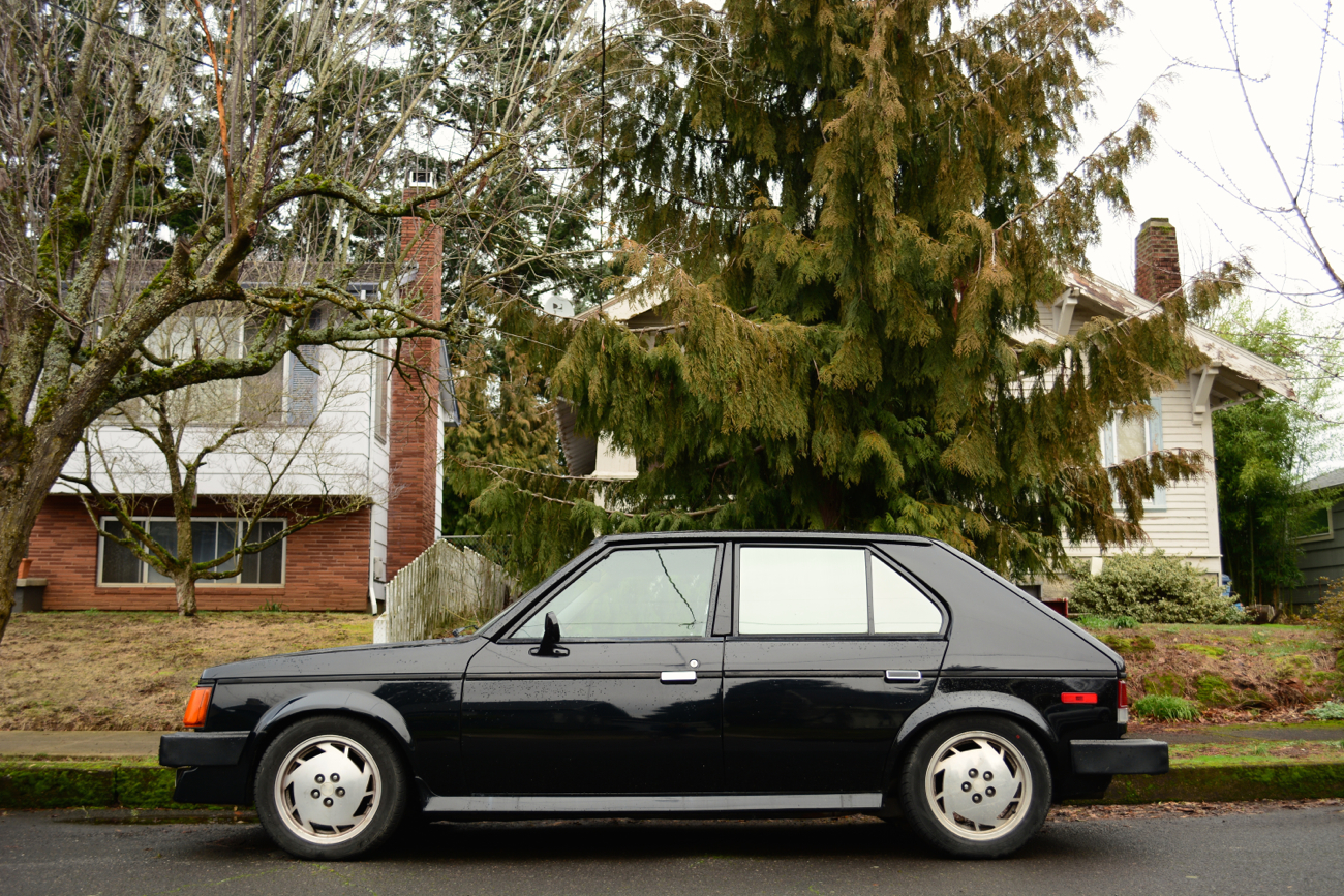 OLD PARKED CARS.: 1986 Shelby GLHS.