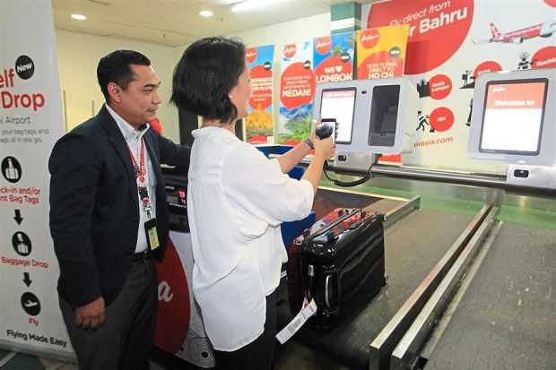 Fasilitas Baru AirAsia Auto Bag Drop