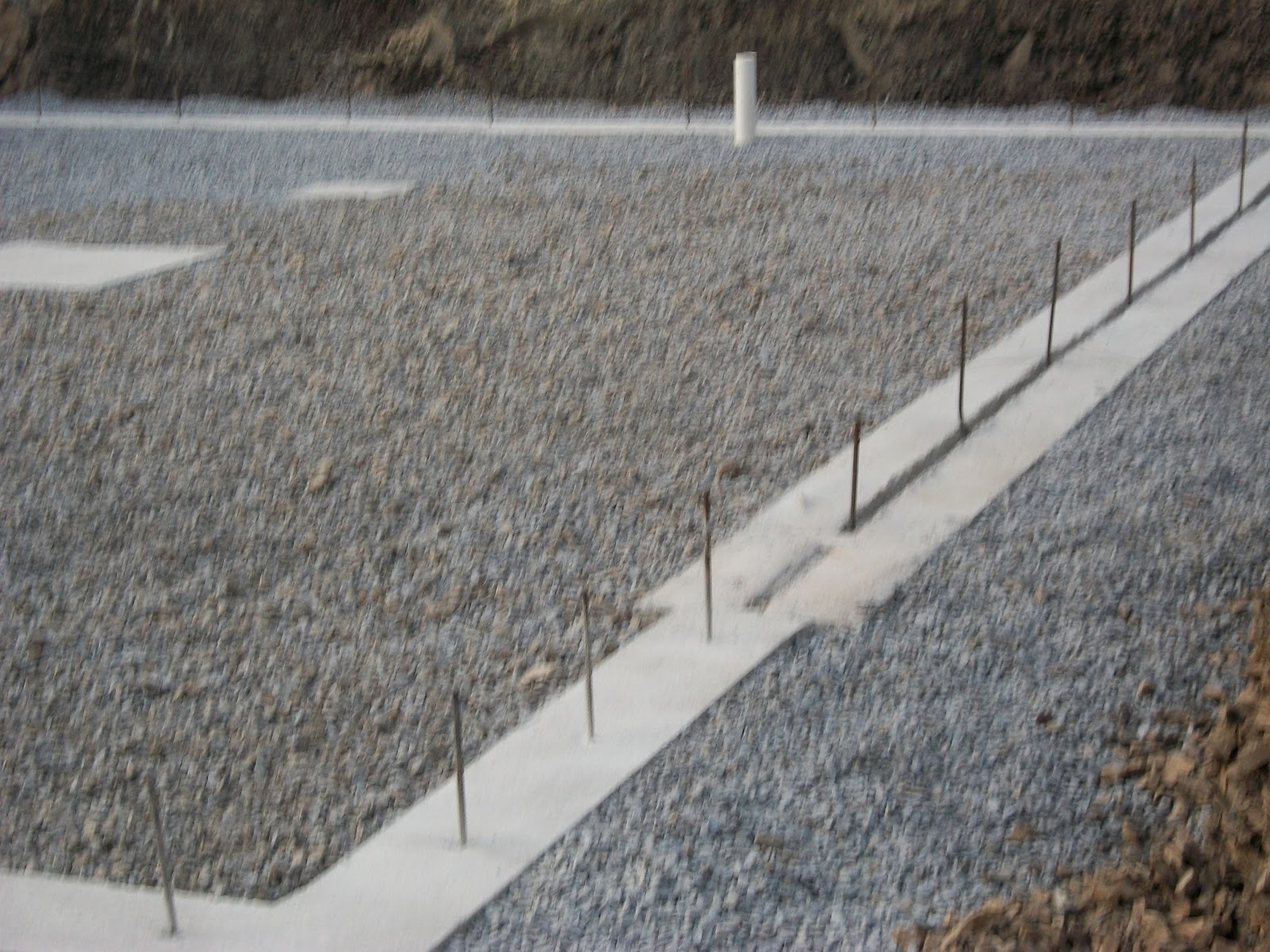 Girl Builds House: Sub-slab #2 stone and footing drain tile.