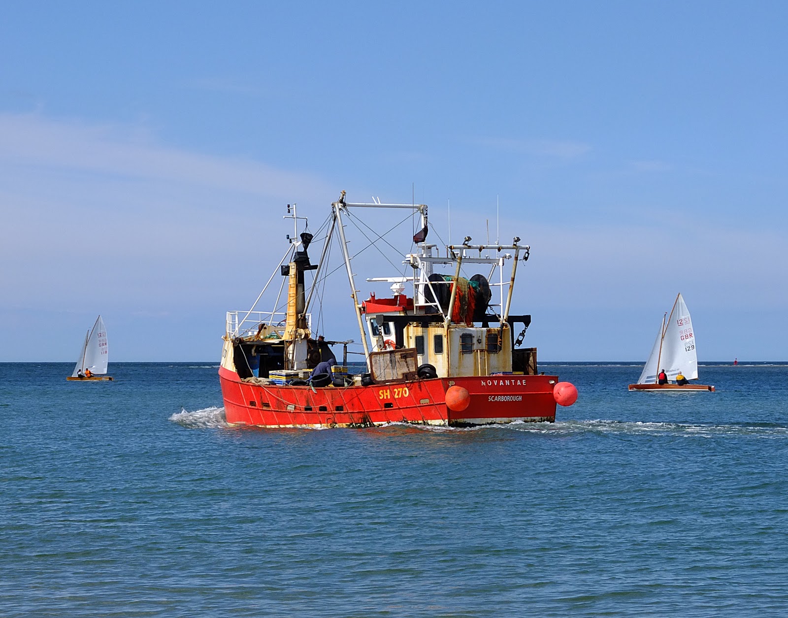 Norfolk 'N Good: Fishing boat sets out on a calm sea