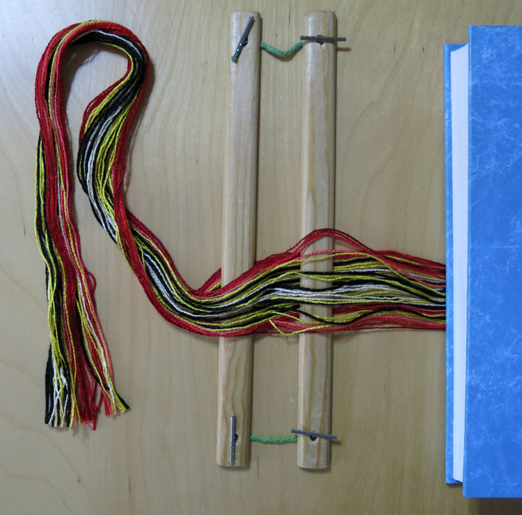 Durham Weaver: Making a warp and threading the 9 pattern slot heddle.