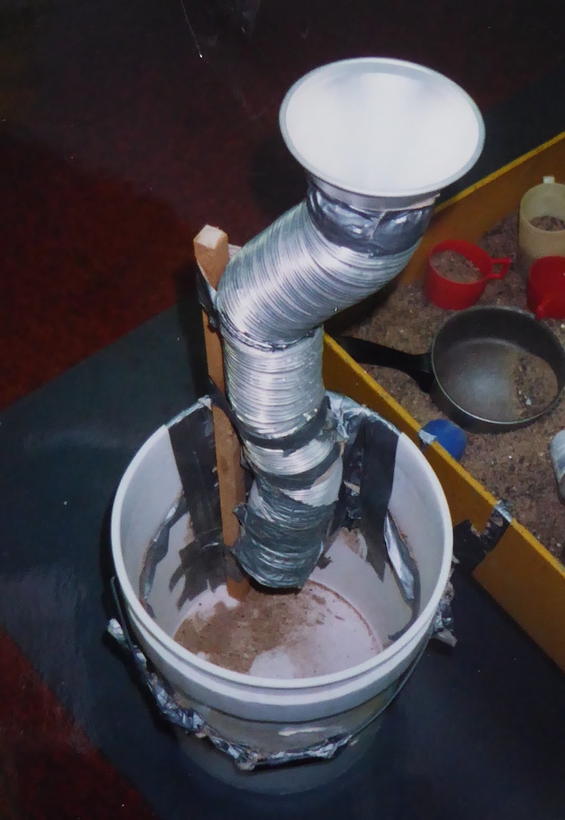 SAND AND WATER TABLES: Flex tube in a bucket