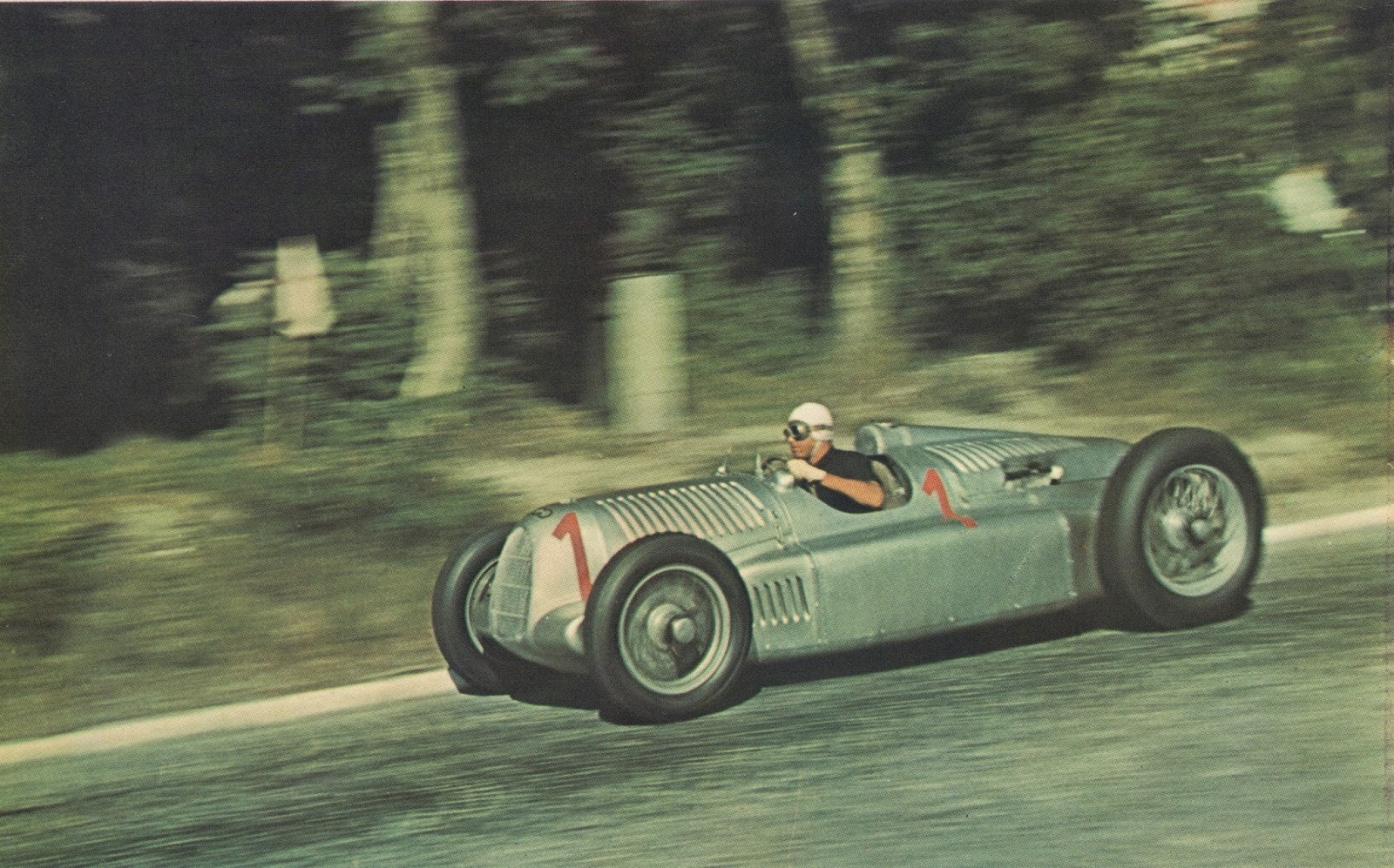 Hermann Muller hurls his Auto Union Type D around the track during the ...