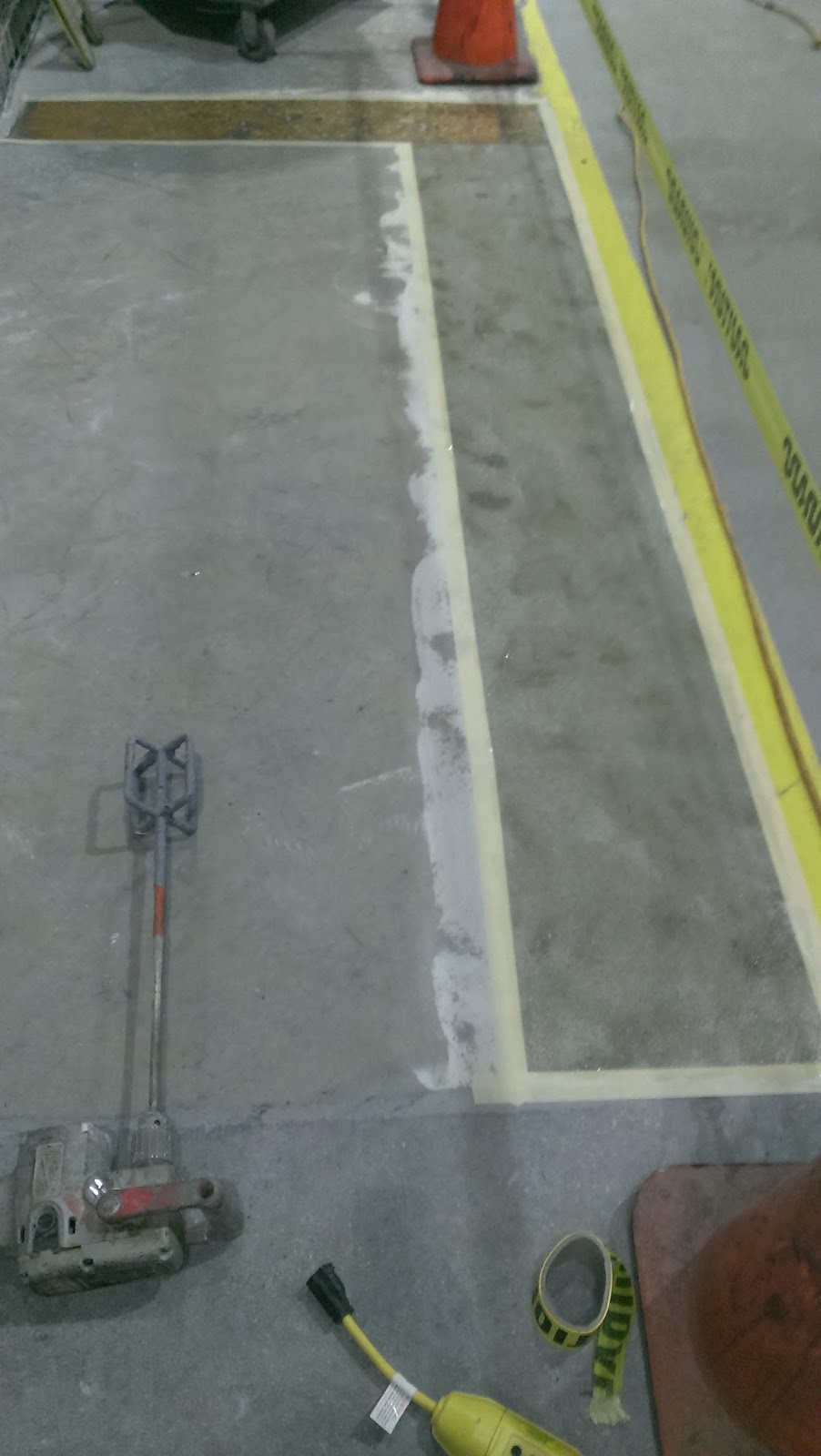 Epoxy Floor Coatings: Building water containment curb - Gainesville, Texas