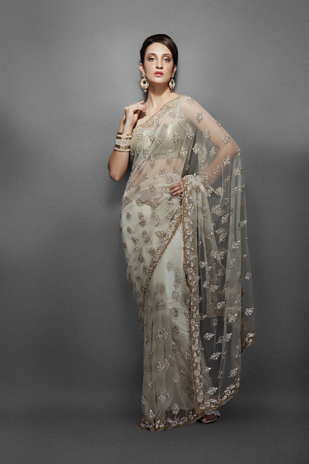 IVORY NET SAREE WITH SLEEVELESS BLOUSE