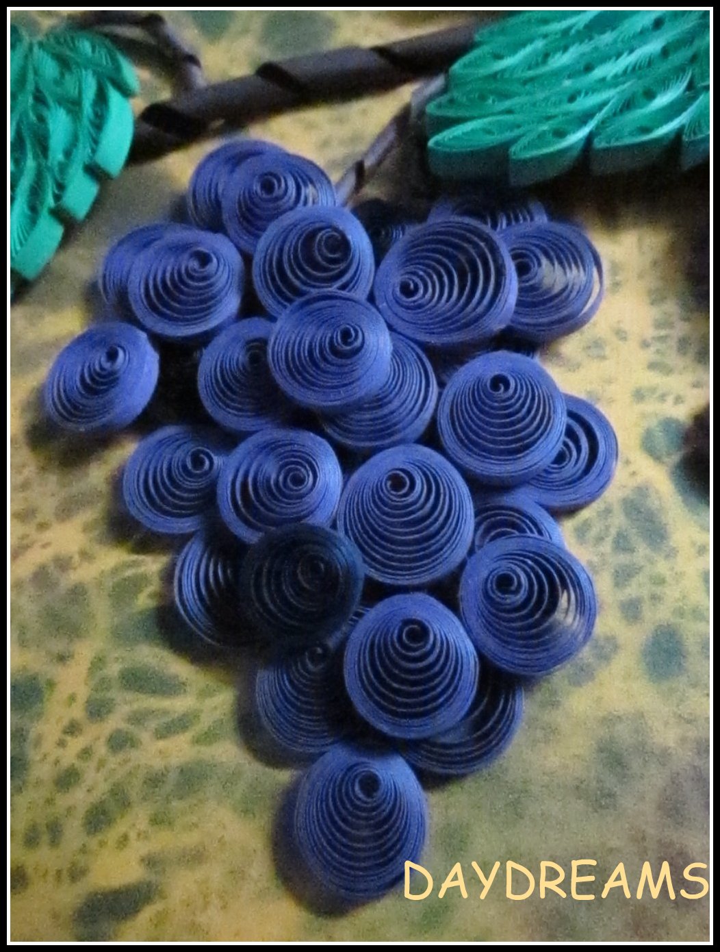 DAYDREAMS: Quilled grape vine.