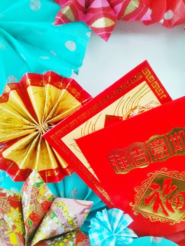 I tucked a couple of red envelopes into the wreath to add a celebratory ...
