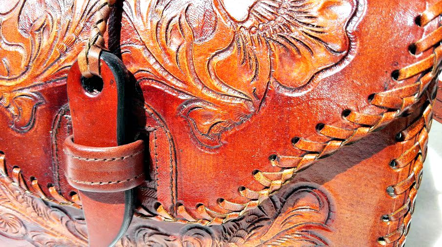 brandylovesvintage: vedasto: convertible tooled leather bag