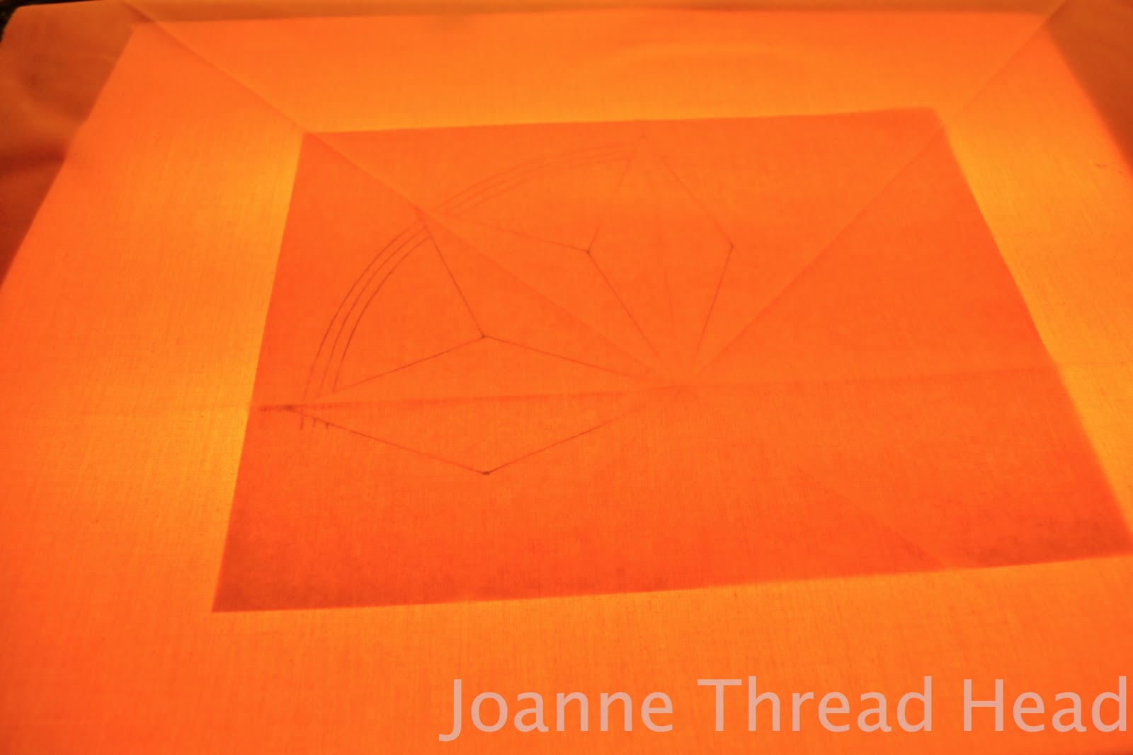 Thread Head: Orange Whole-cloth Quilt