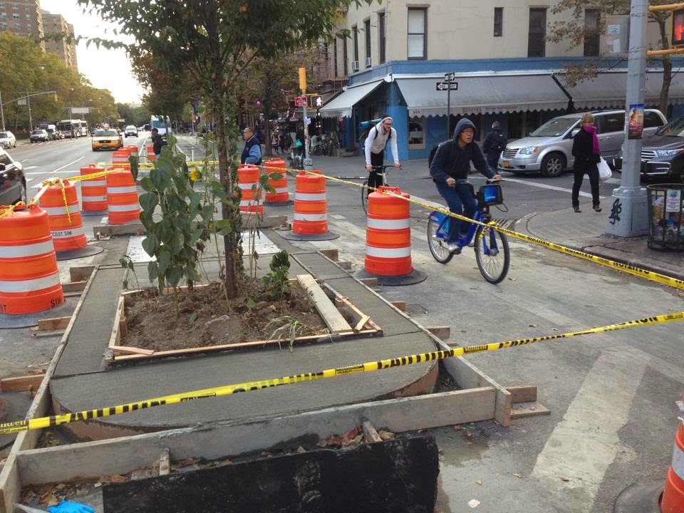 EV Grieve: New bike lane buffers kills off First Avenue garden