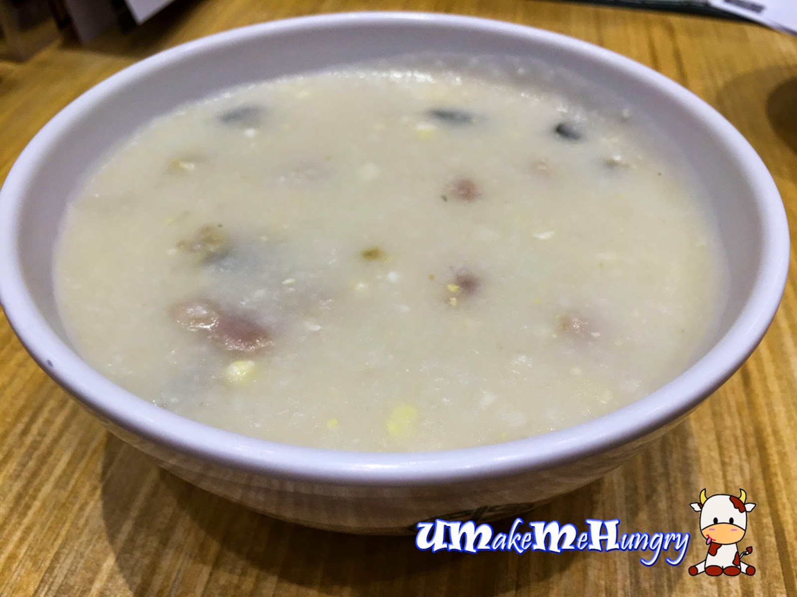 Congee with Pork, Century Egg & Salted Egg - $4.20