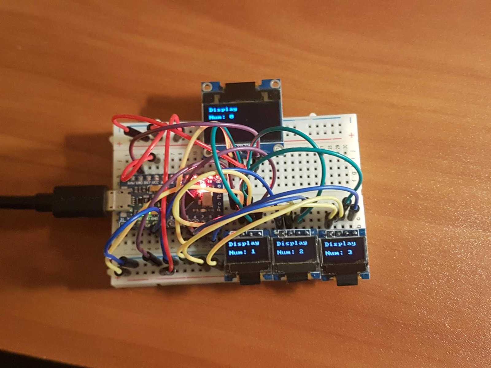 Controlling lots of OLED displays with a few GPIO pins